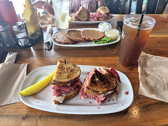 Not just a sandwich, but a monument to meat engineering. This Reuben defies gravity and conventional portion sizes while demanding both hands and your full attention.