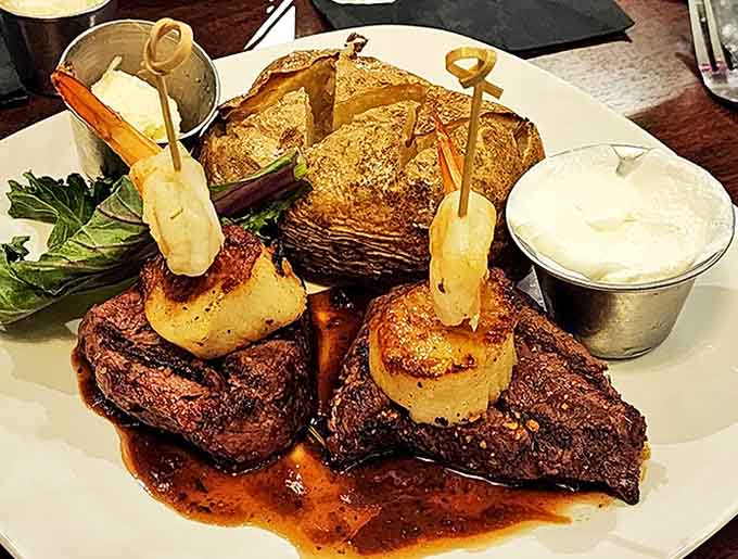 Sea scallops seared to golden perfection crown a tender filet mignon, creating a surf and turf experience that might just change your life.