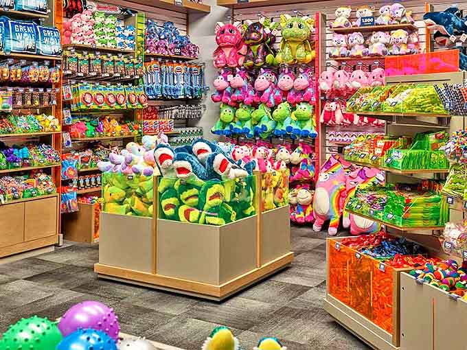 Stuffed animal heaven where wallets go to die and children's eyes light up. The rainbow explosion of plush creatures makes resistance utterly futile.