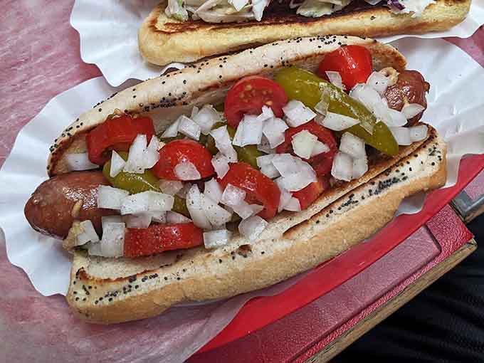 This isn't just lunch, it's a production &ndash; a perfectly dressed hot dog poses dramatically against the backdrop of O'Betty's eclectic decor, promising flavor with theatrical flair.