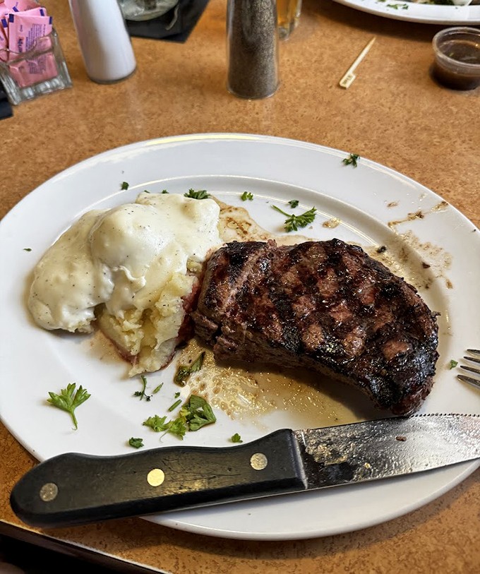 A perfectly grilled steak with a side of mashed potatoes &ndash; proof that sometimes the simplest combinations are culinary perfection.