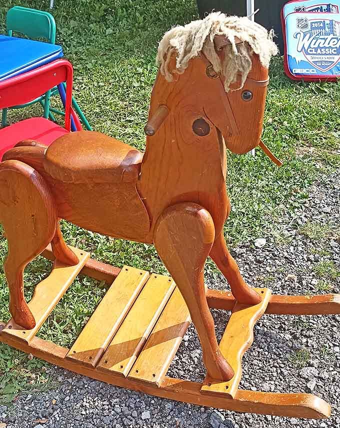 This vintage wooden rocking horse has likely witnessed decades of childhood joy, waiting patiently for its next family to continue the story.