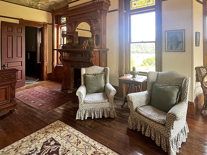 Cozy sitting areas with period-perfect furnishings invite visitors to linger, though some claim they're never truly alone here.