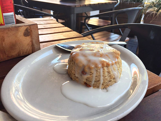 This glazed beauty isn't just a biscuit, it's an edible hug that melts away stress with each buttery, flaky bite.