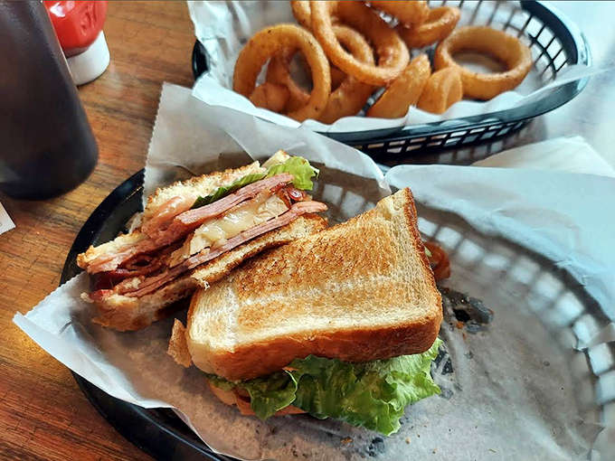This isn't just any sandwich &ndash; it's a perfectly executed BLT with crispy bacon, fresh lettuce, and juicy tomato, served with golden onion rings.