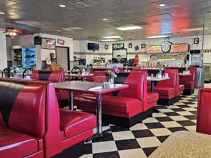 Classic red vinyl booths and checkerboard floors at Woody's 50's Diner set the stage for a nostalgic meal straight out of the sock hop era.