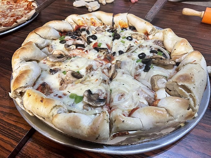 Garden of earthly delights: Fresh mushrooms, olives and veggies nestled in a sea of melted cheese and robust sauce.