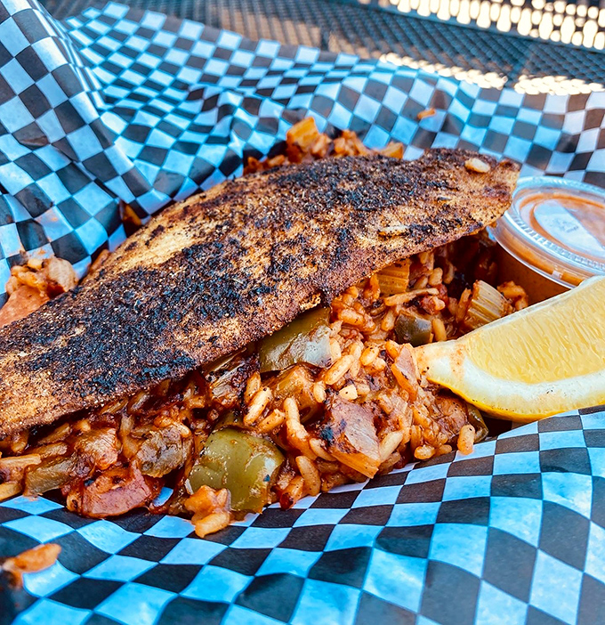 A seafood symphony atop spicy jambalaya &ndash; this dish doesn't just cross state lines, it erases them completely.