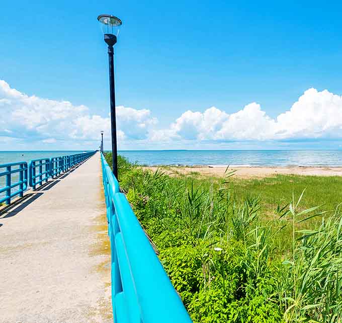 The iconic blue-railed boardwalk stretches toward the horizon, offering contemplative walks and sunset views worth framing.