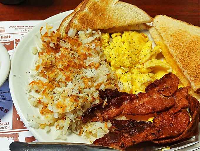 Breakfast perfection on a plate &ndash; crispy hash browns, fluffy eggs, and bacon that shatters like glass when you bite it.