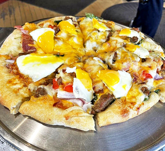 Breakfast reimagined: eggs, bacon, and cheese transform morning classics into pizza perfection. Who says pizza can't be eaten before noon?