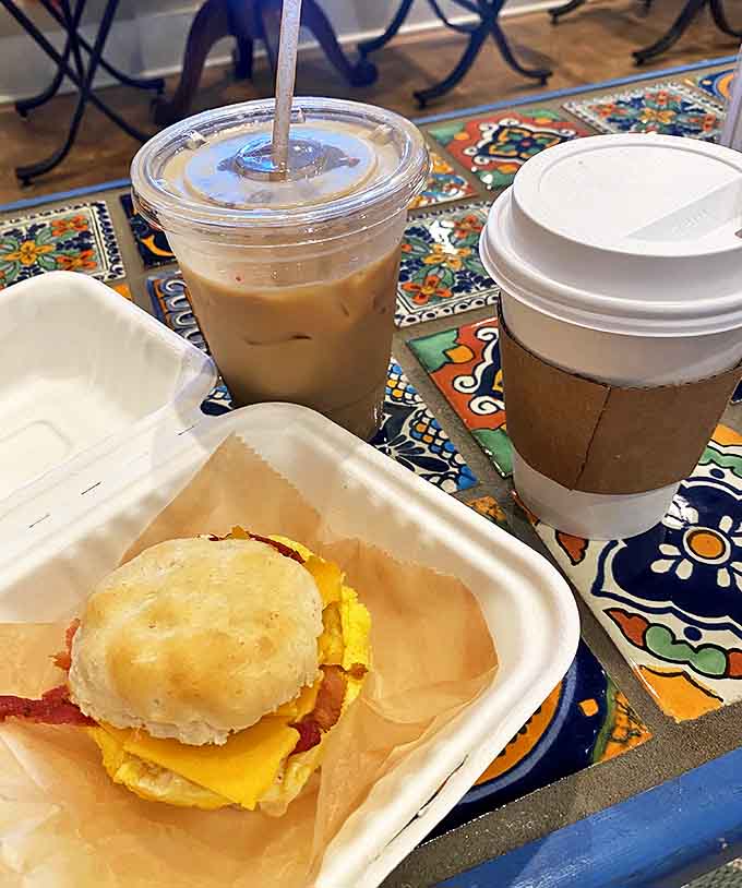 Breakfast sandwiches don't get more comforting than this &ndash; a fluffy biscuit embracing eggs, cheese and bacon while cats prowl nearby.