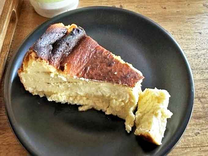 The Burnt Basque Cheesecake's caramelized exterior gives way to a creamy center that's like velvet on the tongue – culinary magic in slice form.