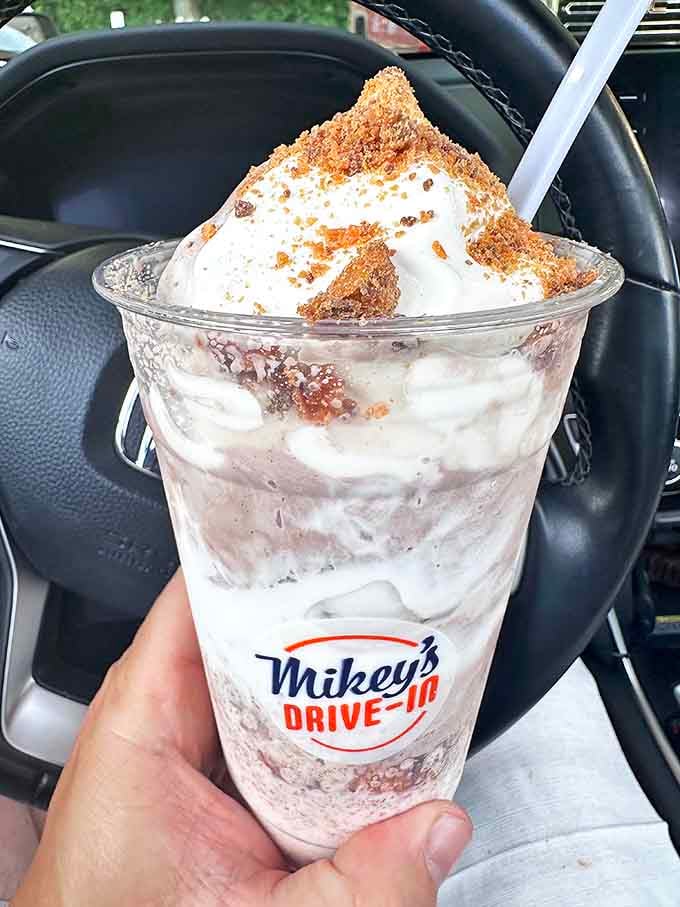 This isn't just a shake &ndash; it's a creamy archaeological dig where each spoonful reveals another treasure of crushed Butterfinger waiting to be discovered.