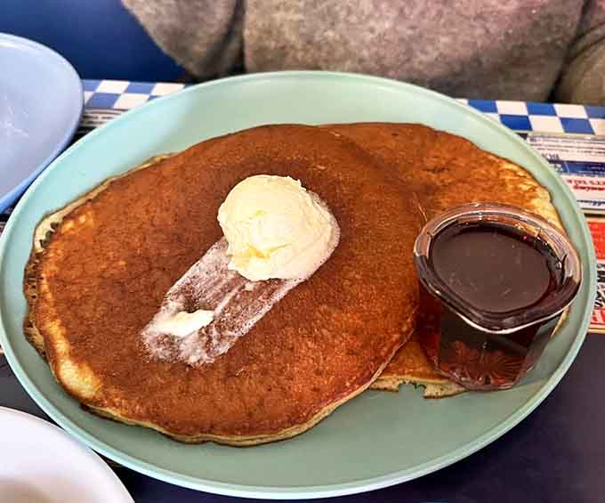A pat of butter slowly melting into freshly-made pancakes with maple syrup on standby &ndash; morning bliss awaits your first bite.