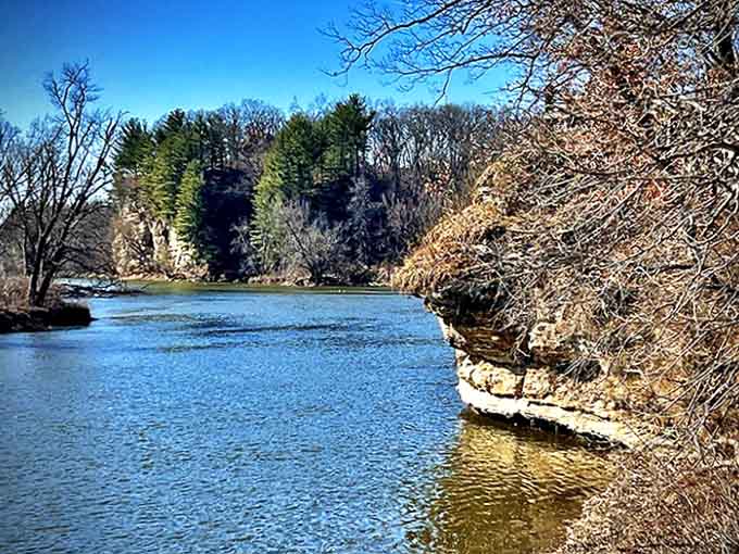 Ancient rock walls meet calm waters in reflections so perfect they look Photoshopped, but Mother Nature doesn't need filters.