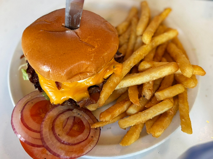 The Classic Cheeseburger – where melted American cheese embraces the patty like it's found its soulmate at last.