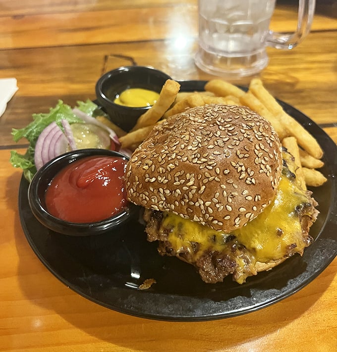 Burger perfection on a sesame seed throne – juicy, cheese-draped, and demanding to be devoured with both hands and plenty of napkins.