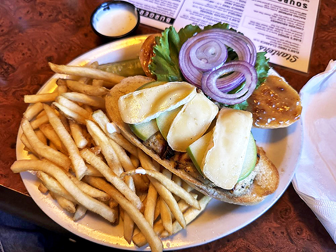 The Chicken Breast Brie Sandwich arrives like edible architecture &ndash; layers of flavor stacked between bread that deserves its own fan club.