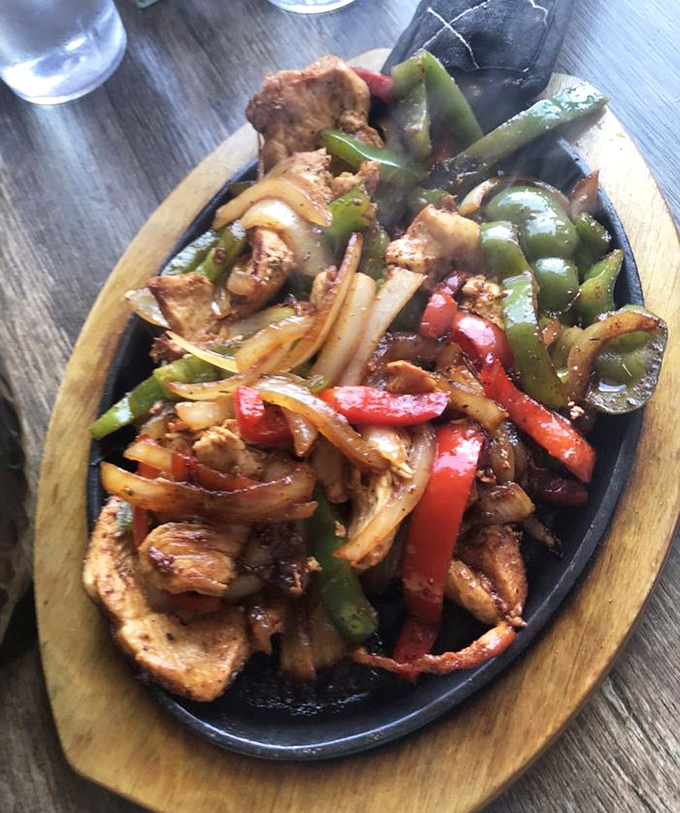 Chicken fajitas with perfectly charred peppers and onions &ndash; a colorful fiesta that tastes even better than it looks. Those veggies aren't just garnish!