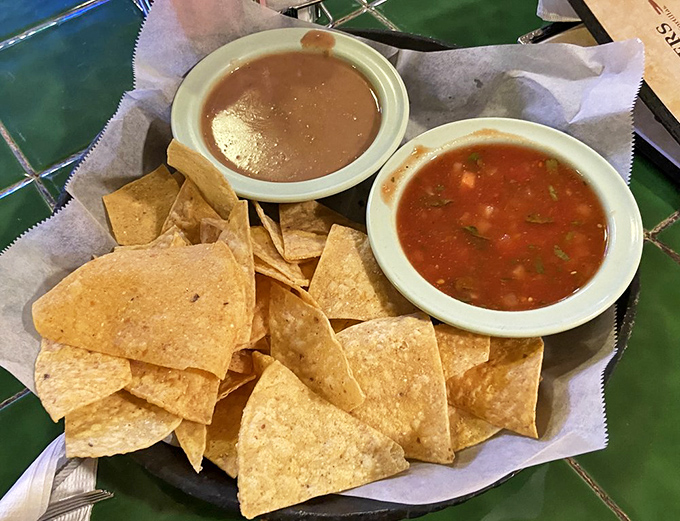 The chips and salsa ritual begins &ndash; warm, crispy triangles ready to dive into fresh pico and that addictive house salsa.