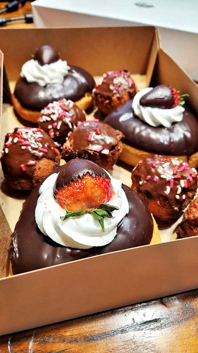A box of chocolate-dipped treasures garnished with strawberries and sprinkles &ndash; proof that sometimes the best gifts come in cardboard containers.