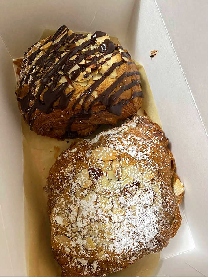 Chocolate drizzle zigzags across buttery layers like an artist's final flourish, transforming breakfast into an occasion worth celebrating.