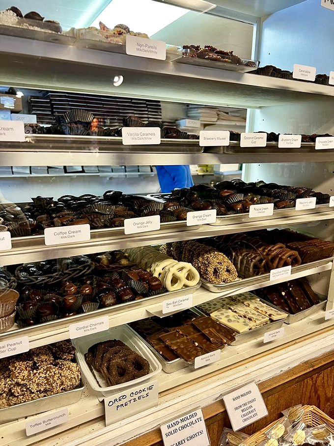 The chocolate display case &ndash; a museum of cocoa artistry featuring everything from truffles to bark. Resistance is futile, just surrender to the sweetness.