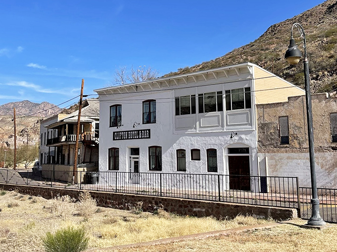 The Clifton Hotel & Bar occupies a historic white building, offering both caffeine and a perfect vantage point for people-watching.