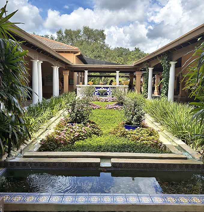 A geometric garden sanctuary where symmetry meets serenity – this courtyard's meticulous design proves nature and architecture can dance beautifully together.