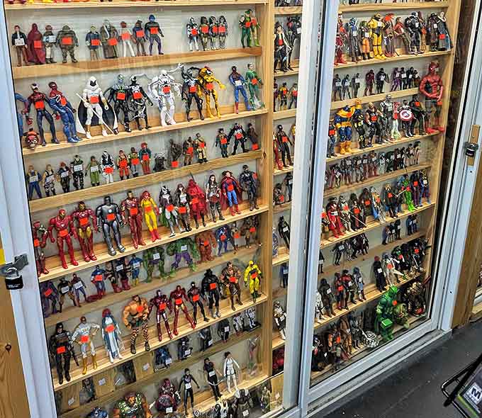 Superheroes stand at attention in pristine display cases, ready to leap into action or onto a collector's shelf.