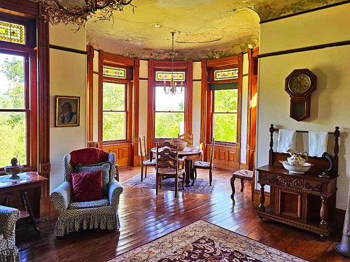 The curved bay dining area captures Vermont's natural beauty through stained glass transoms, making even a peanut butter sandwich feel like a royal feast.