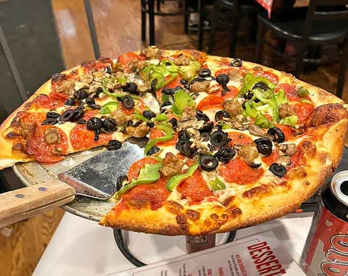 This loaded masterpiece proves that sometimes more is more, especially when cheese and toppings are involved.