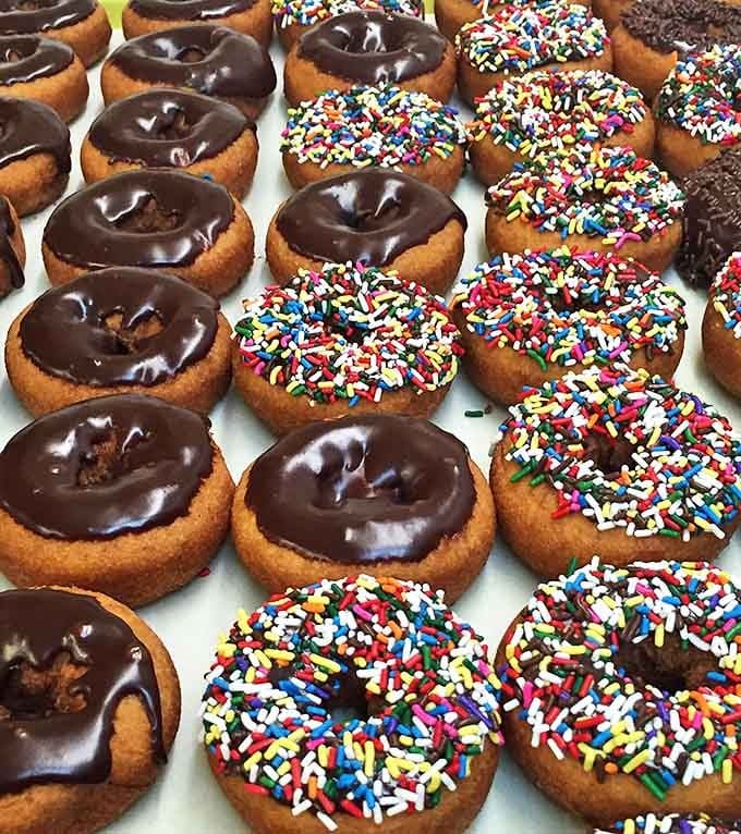 Chocolate-glazed perfection meets rainbow sprinkle joy &ndash; proof that happiness can indeed be found in a perfectly round shape with a hole.