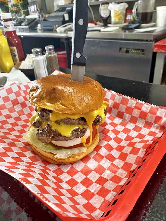 When a burger needs a knife to hold it together, you know you're dealing with serious business, not some wimpy fast-food imposter.