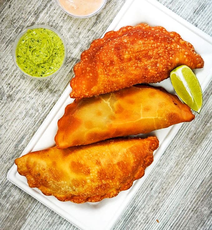 Golden half-moons of happiness, these hand-held treasures deliver perfectly seasoned fillings wrapped in pastry that's both sturdy and tender.