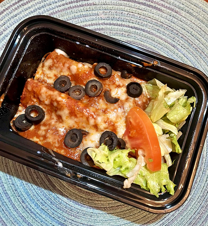 Cheese-covered comfort nestled in a pool of rich red sauce, these enchiladas prove that sometimes the simplest dishes deliver the most satisfaction.