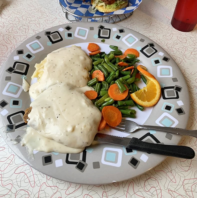 The crown jewel of Route 66 cuisine arrives smothered in pepper-flecked gravy that's practically drinkable.