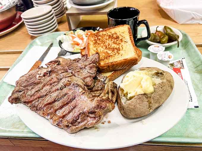 This T-bone with all the fixings is what steak dreams are made of, complete with a loaded baked potato and toast.