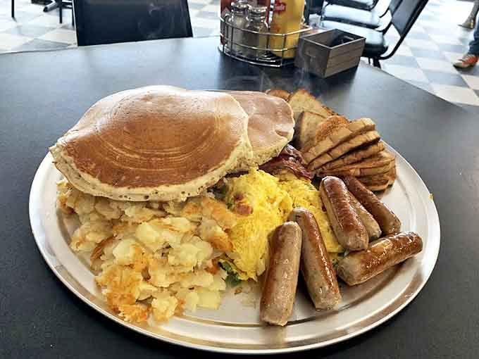 Pancakes so fluffy they practically hover, sausage links standing at attention, and home fries that put all other potatoes to shame.