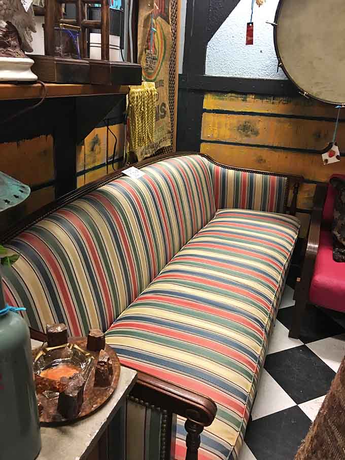 This camelback sofa in cheerful stripes has supported more conversations and afternoon naps than we can count, and it's ready for more.