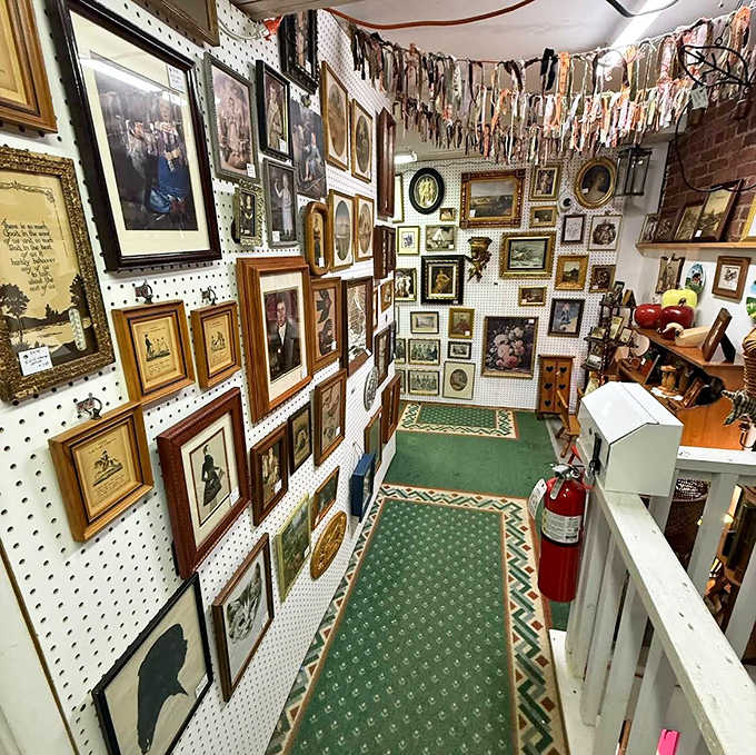 A gallery wall to rival any museum, where forgotten family portraits and landscapes create a patchwork of American visual history.