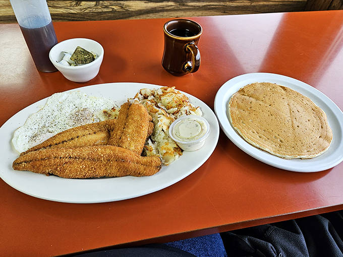 Lake Superior's bounty arrives as perfectly fried fish fillets alongside eggs and a pancake that could float away if not weighed down.