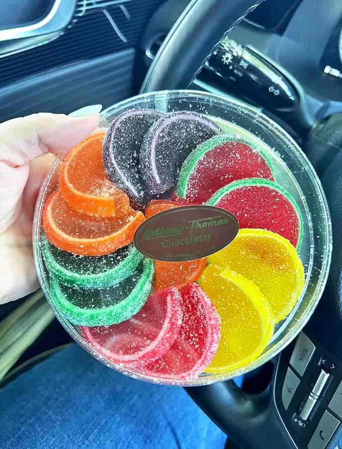 A rainbow wheel of sugar-dusted fruit slices brings technicolor joy to the chocolate party &ndash; each wedge bursting with bright, nostalgic flavor.