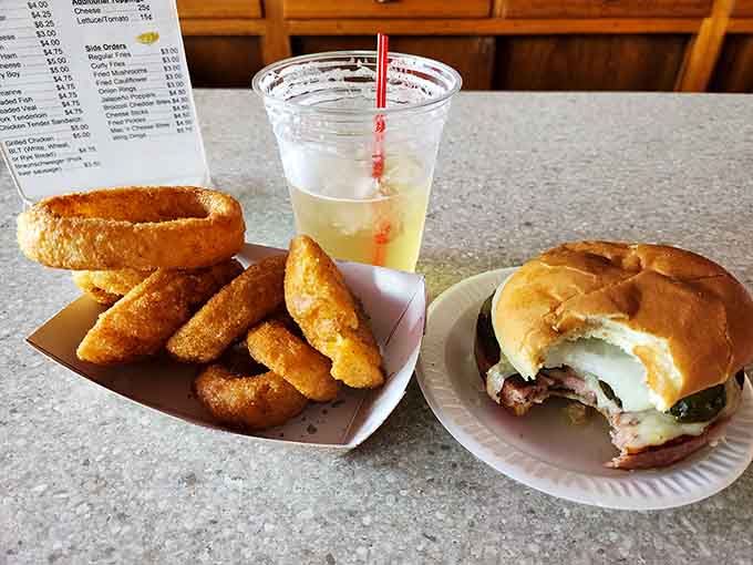 Golden onion rings accompany the legendary bologna sandwich, creating a combo that's pure comfort food magic.