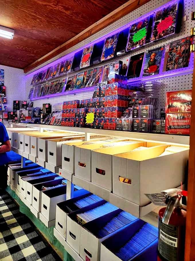 Comic book heaven illuminated by purple lights, where childhood heroes wait in plastic sleeves and cardboard boxes for collectors to discover.