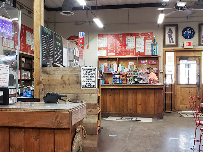 The heart of the operation, where locals and travelers converge over coffee and conversation, sharing stories beneath Western-themed decor.