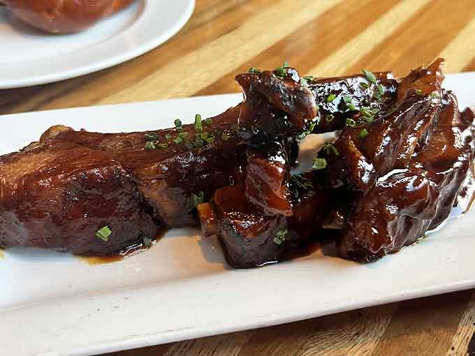 These braised beef short ribs have been slow-cooked into submission, glistening with sauce and ready to surrender to your fork.