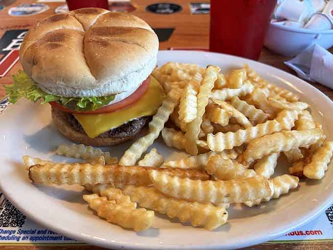 This burger towers with toppings and comes with waffle fries, proving that lunch here is just as impressive as breakfast.