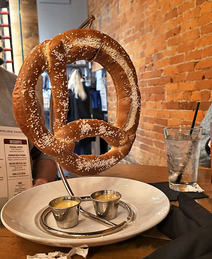 The Godzilla of bar snacks! This twisted masterpiece hangs dramatically, waiting to be dunked in accompanying sauces like a carb-loaded trapeze artist.